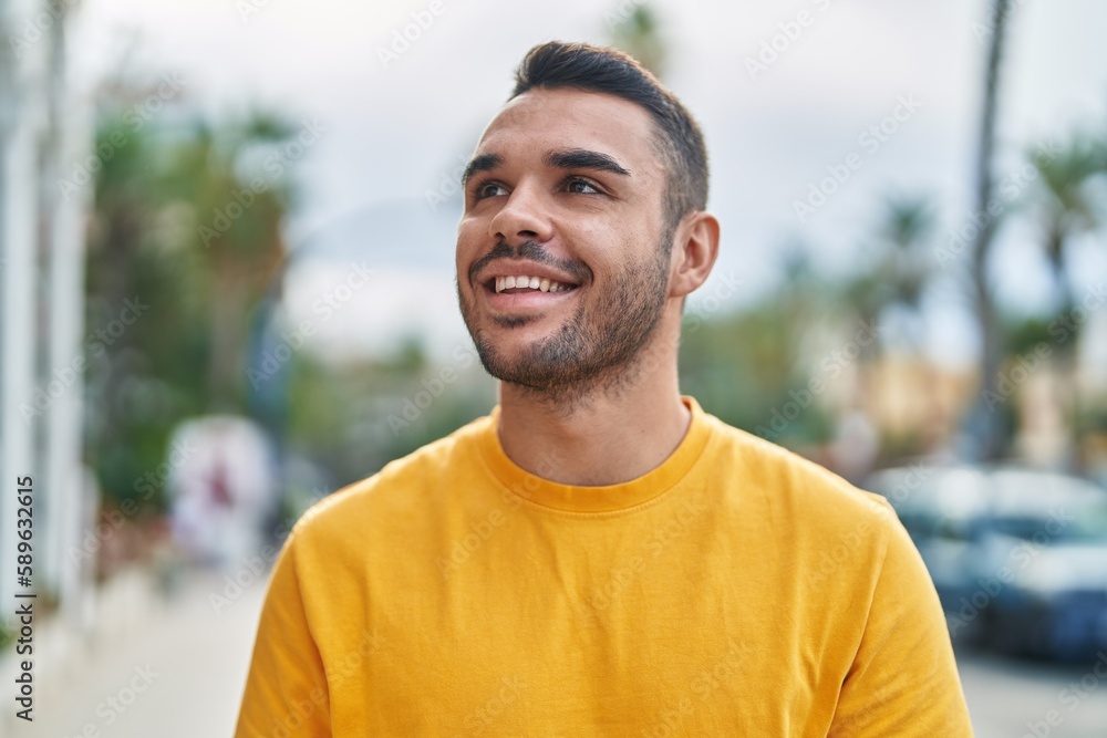 Young hispanic man smiling confident looking to the sky at street Stock ...
