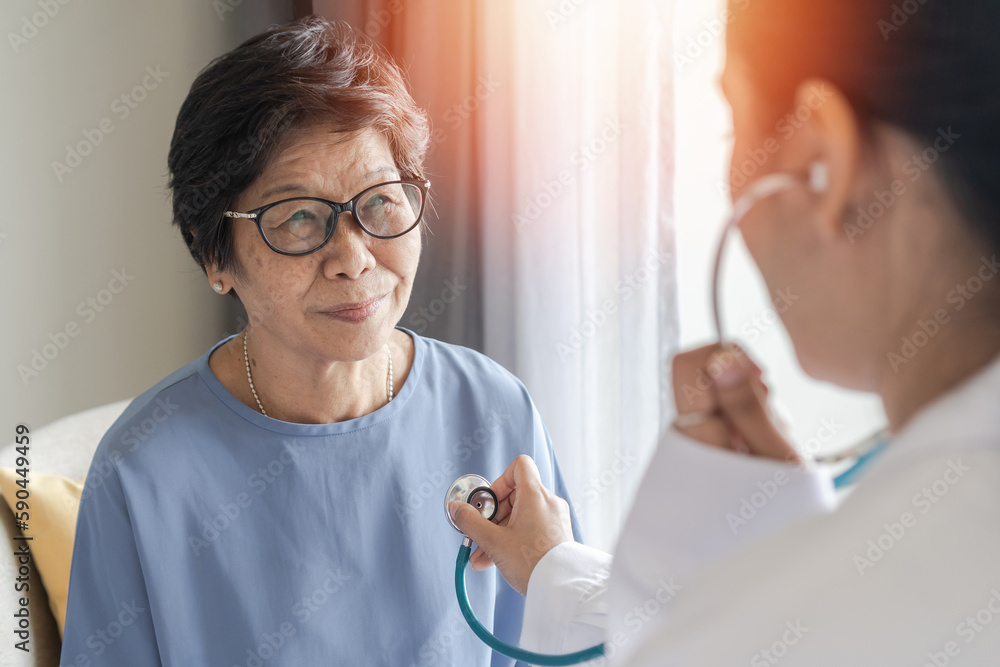 Happy elderly patient with medical health checkup with cardiologist or ...