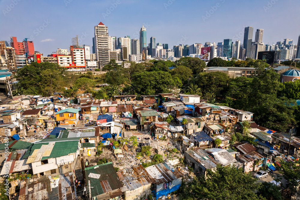 Metro Manila, Philippines - A squatter colony contrasts with the modern ...