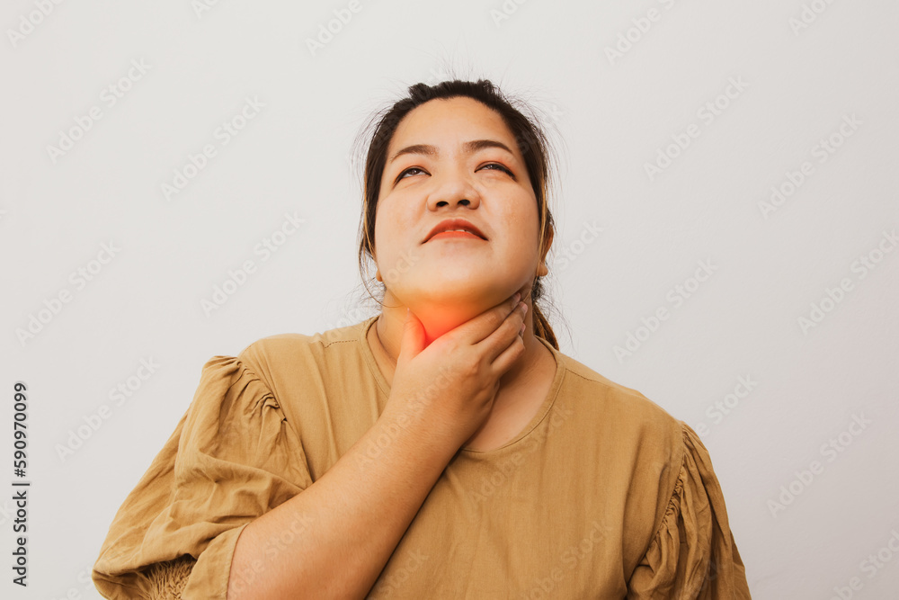 Foto de Stock Asian obese woman having abnormal symptoms holding her ...