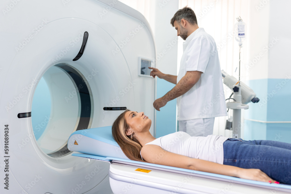 Doctor Control and Monitor MRI or CT Scan with Female Patient ...