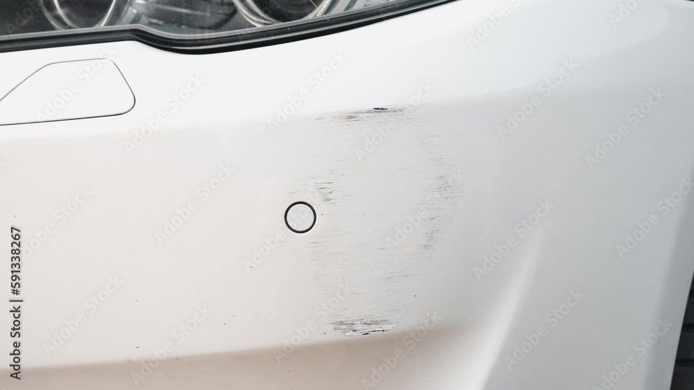 Deep scratches and paint damage on a bumper vehicle. car scratch and ...