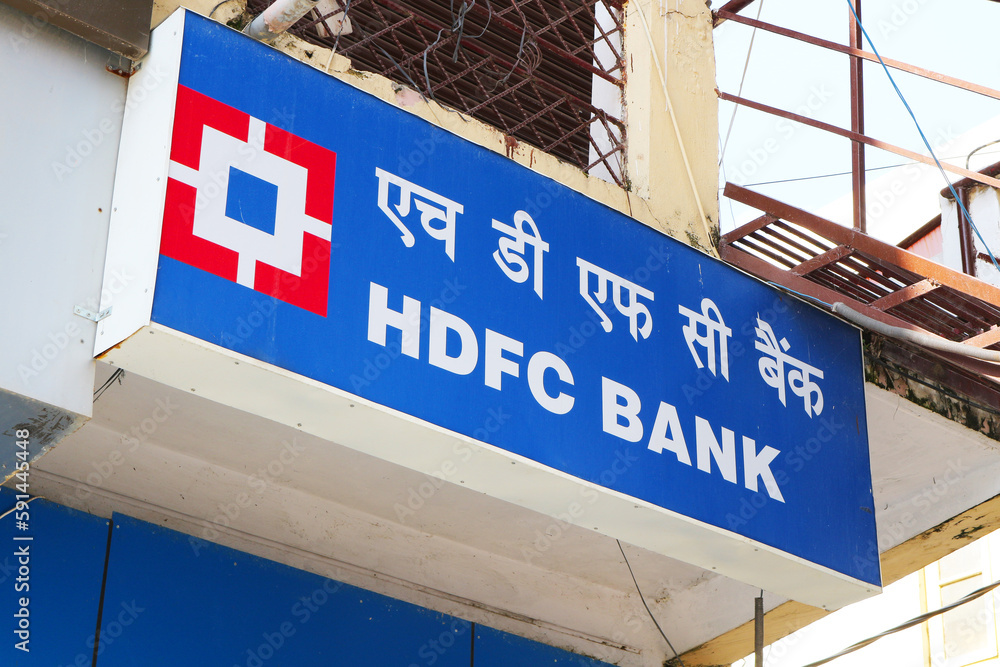 Banner with the name HDFC bank above the entrance to the bank branch ...