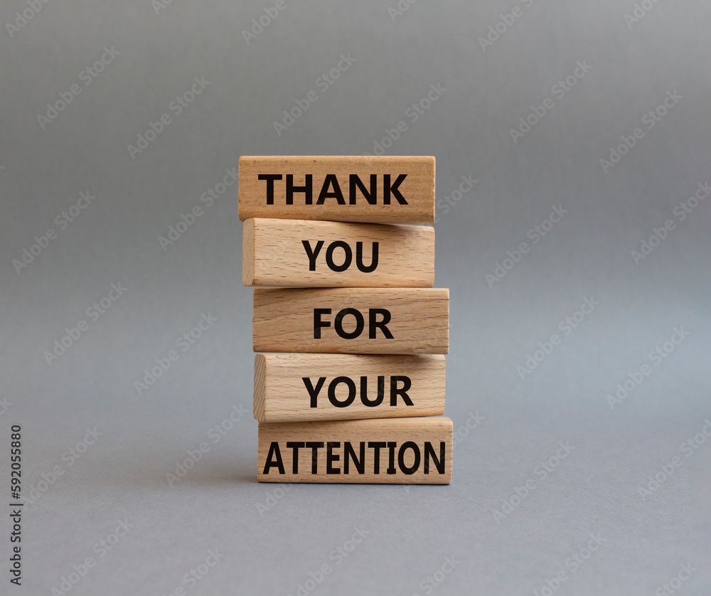 Attention symbol. Wooden blocks with words Thank you for your attention ...