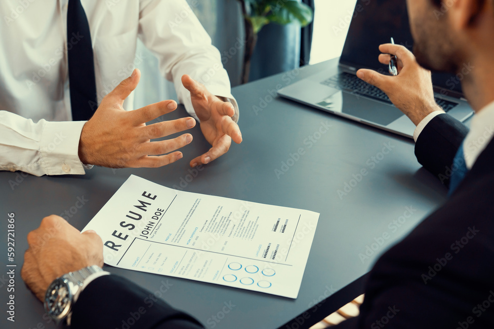 Interviewing job applicant in office with resume paper. Candidate wear ...