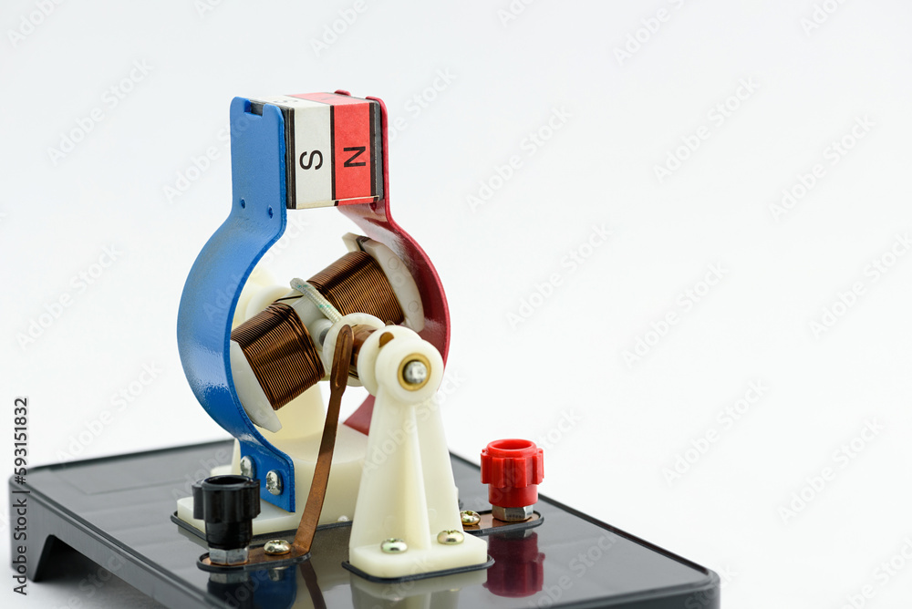 Experimental electric generator on white background, consists of copper ...
