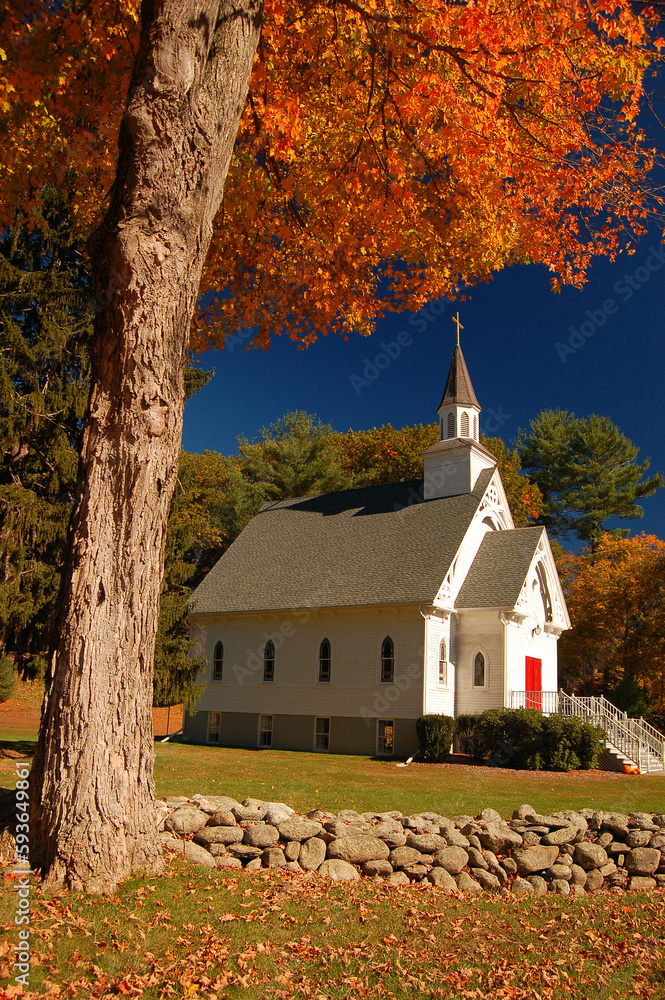 Autumn leaves,, a stone wall and a charming village chapel and church ...