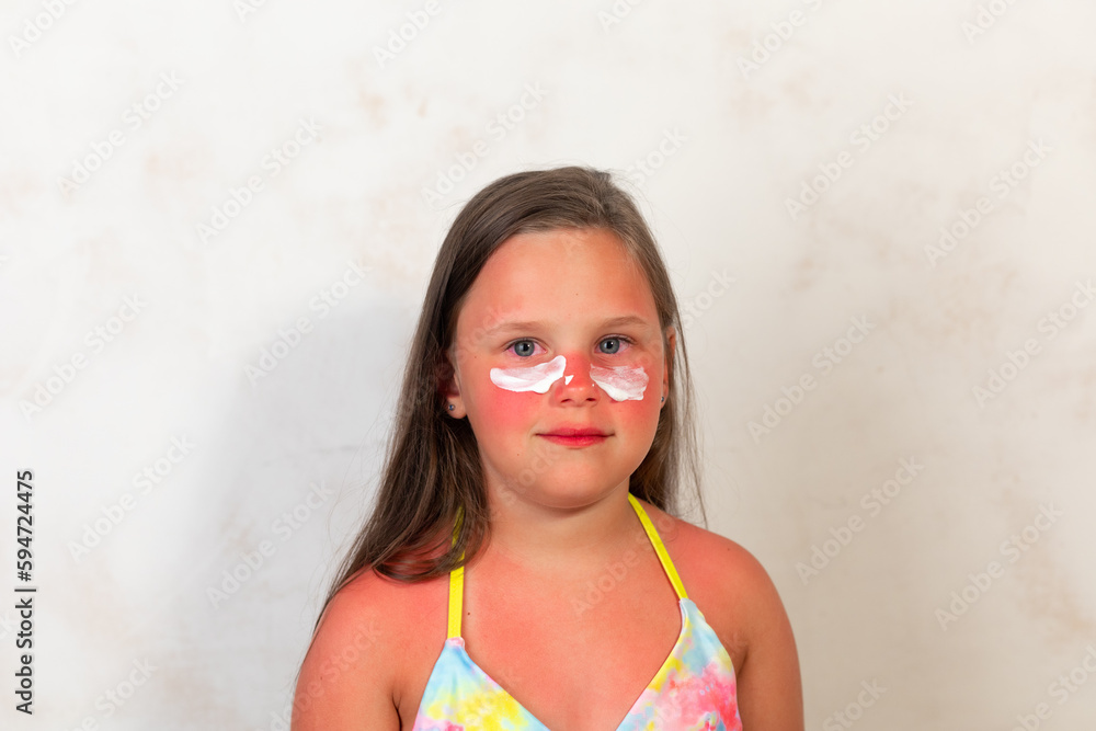 Pretty school aged girl stand in swimsuit with severe burns on face ...