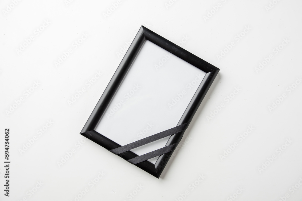 top view empty picture frame of deceased person on the white background ...