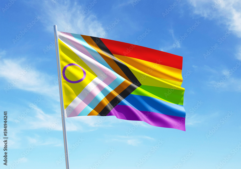 Progress Pride with intersex inclusion rainbow flag waving in a blue ...