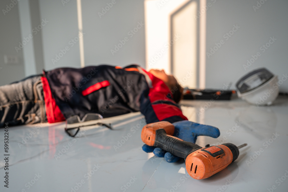 1 Male construction worker fainting at construction site High ...