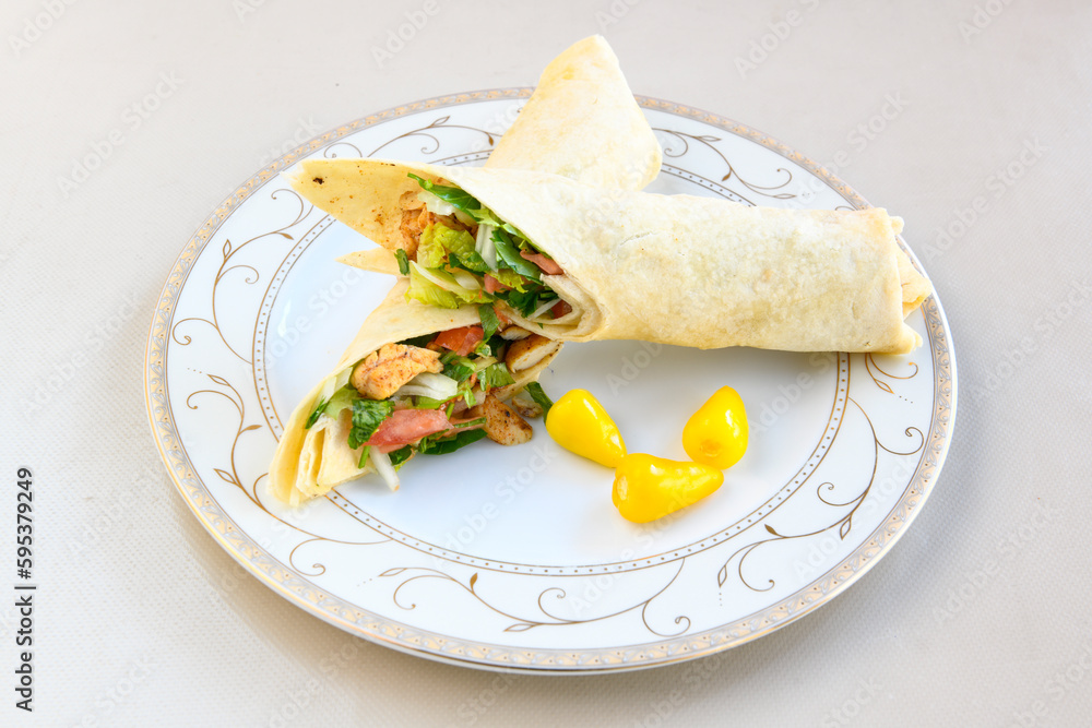 Lavash zurna doner kebab ( zurna durum ) or shawarma sliced in plate ...