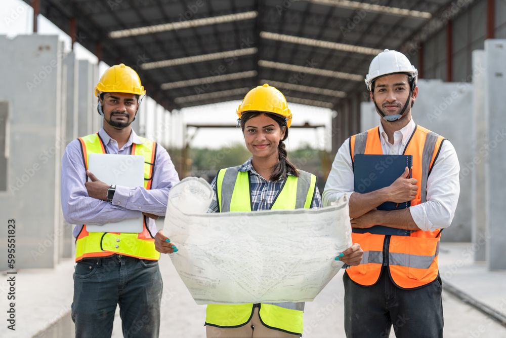 Group Indian construction team engineer wear vest and helmet safety and ...