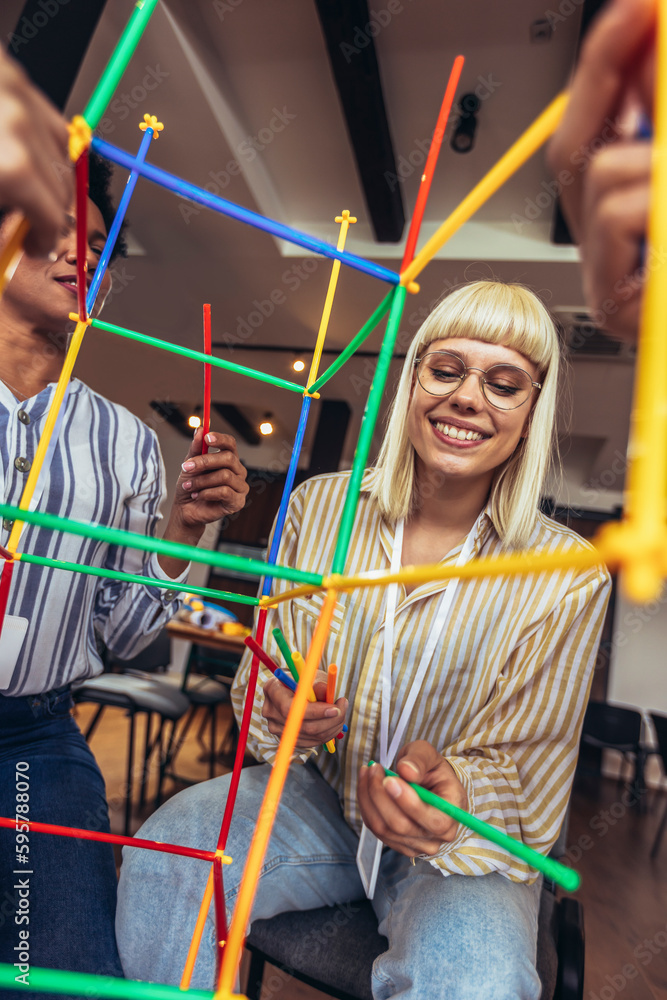 Team building activities in the office with sticks.Concept of ...