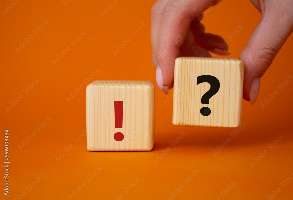 Question mark and exclamation mark symbol. Businessman hand is making a ...