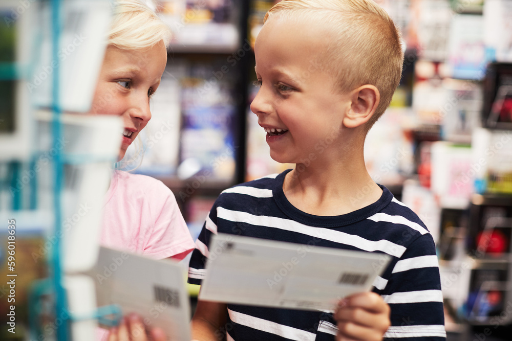 Cute little brother and sister laughing while standing together in a ...