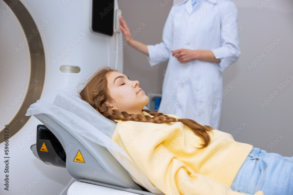 Photo Stock Little girl lying in mri scan machine unrecognizable ...