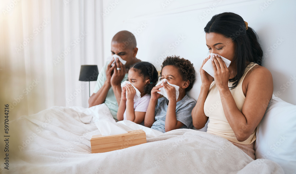 Sick, flu and family on a bed, tissue and blowing nose with illness ...