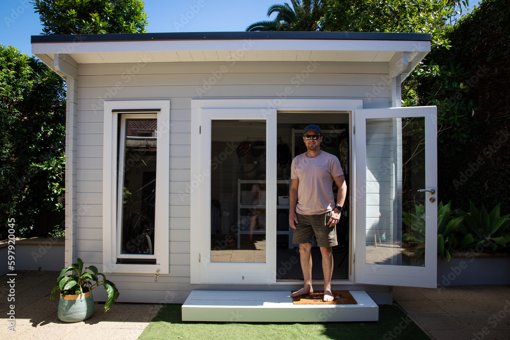Man father standing front modern hamptons white grey backyard storage ...
