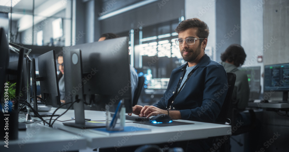 Portrait of a Thoughtful Engineer Working on Desktop Computer in a ...