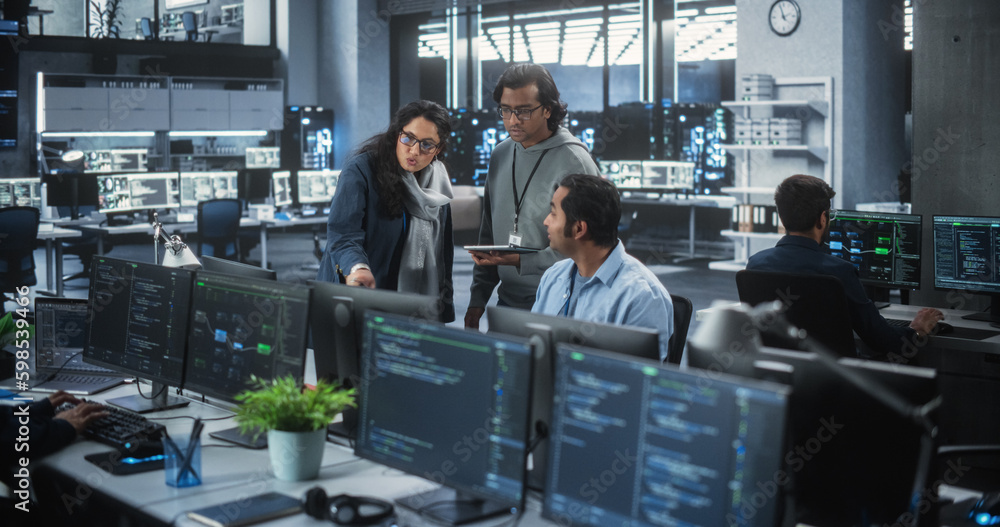 Team of Three Young Indian Software Engineers Use Computer to Discuss a ...