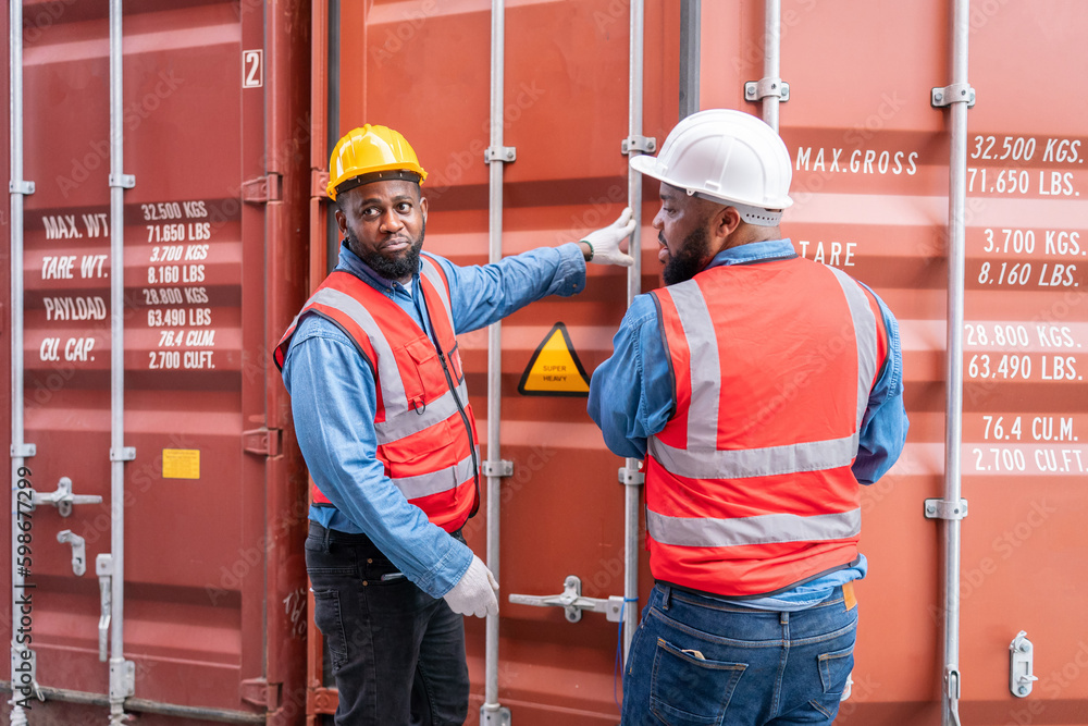 Portrait of Two African Engineer or foreman wears PPE checking ...