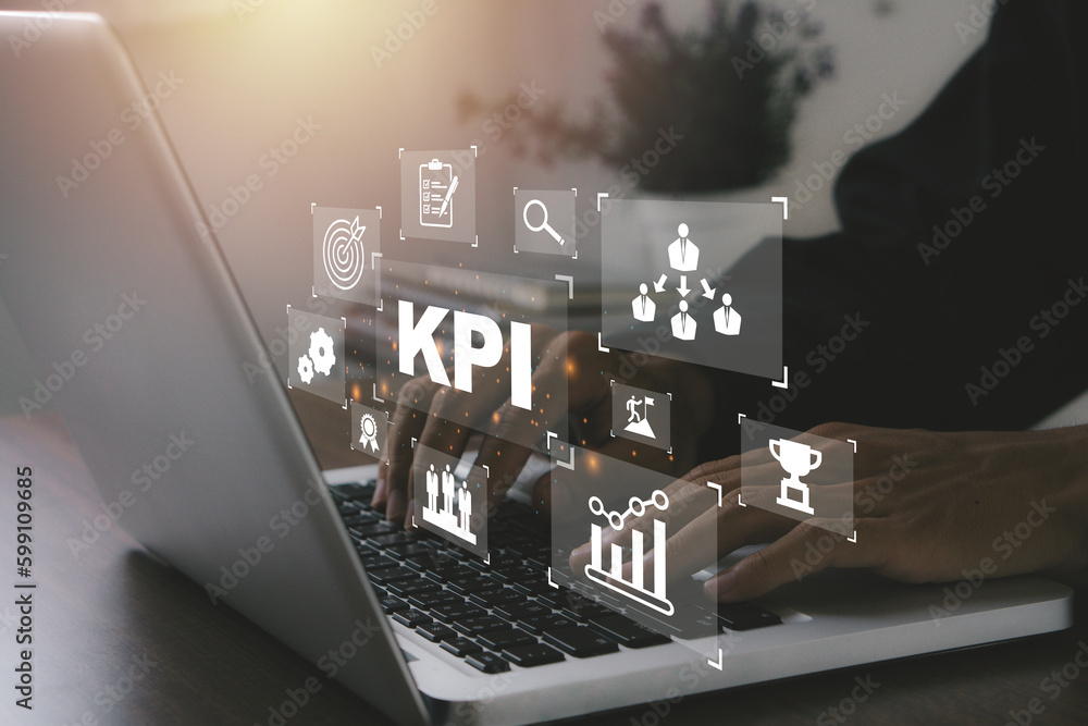 KPI(key performance indicators).Businessmen using a computer to KPI ...