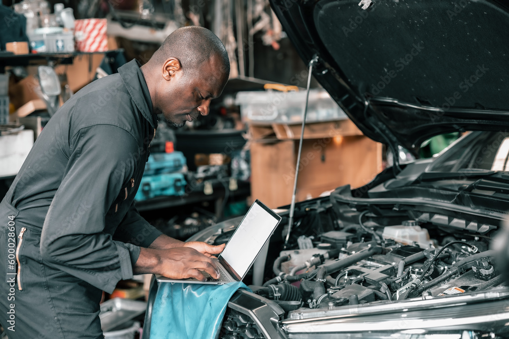 Experienced auto mechanics inspect car battery terminals and voltage to ... Experienced auto mechanics inspect car battery terminals and voltage to ...