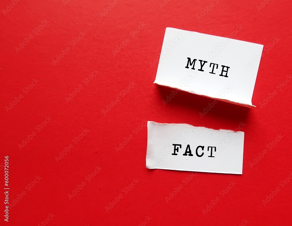 Torn paper on red copy space background with text written FACT and MYTH ...