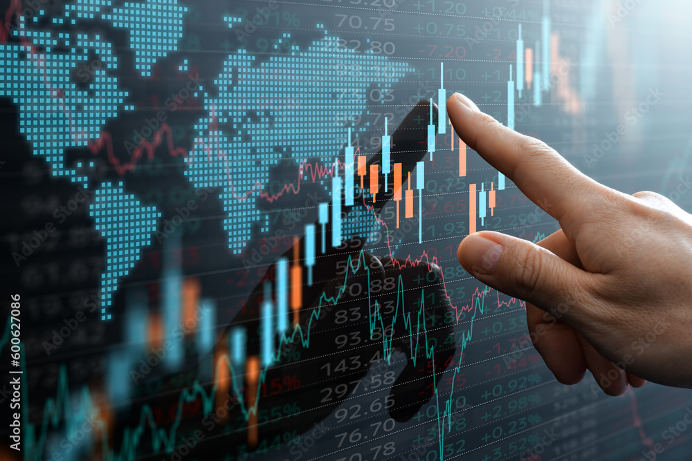 Graphs and world financial markets data. Investor pointing at the ...