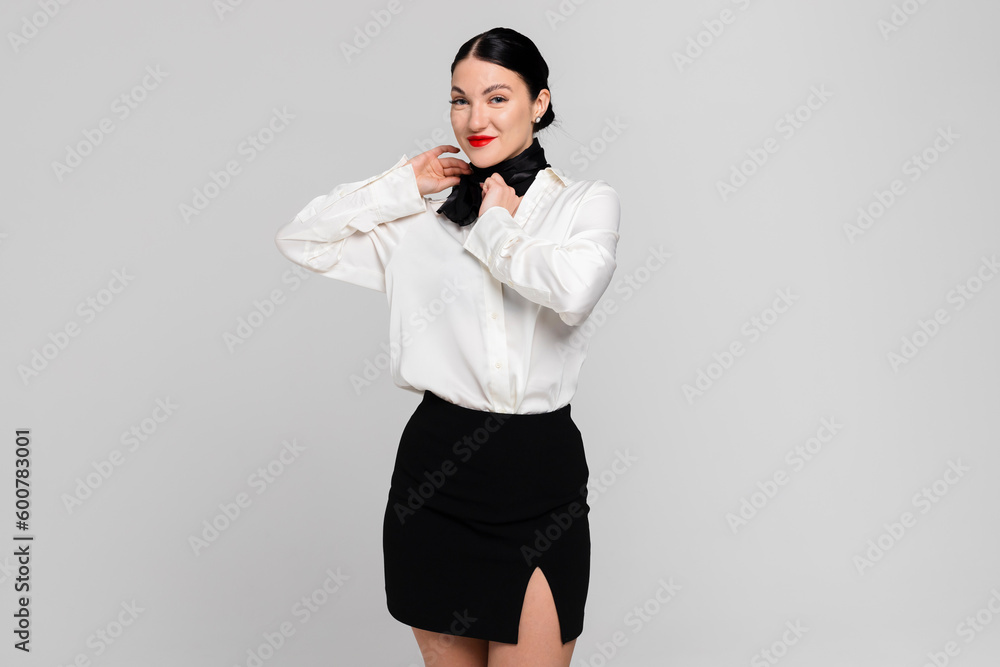 Portrait of an attractive young Stewardess. Charming, smiling air ...