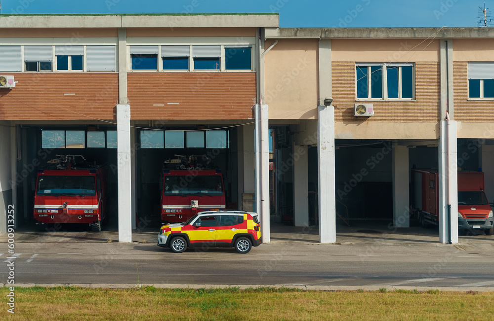 Fire station with fire trucks inside. Stock Photo | Adobe Stock