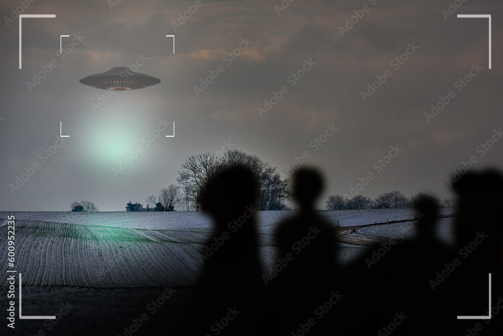 UFO, alien and camcorder on a camera display to record a flying saucer ...