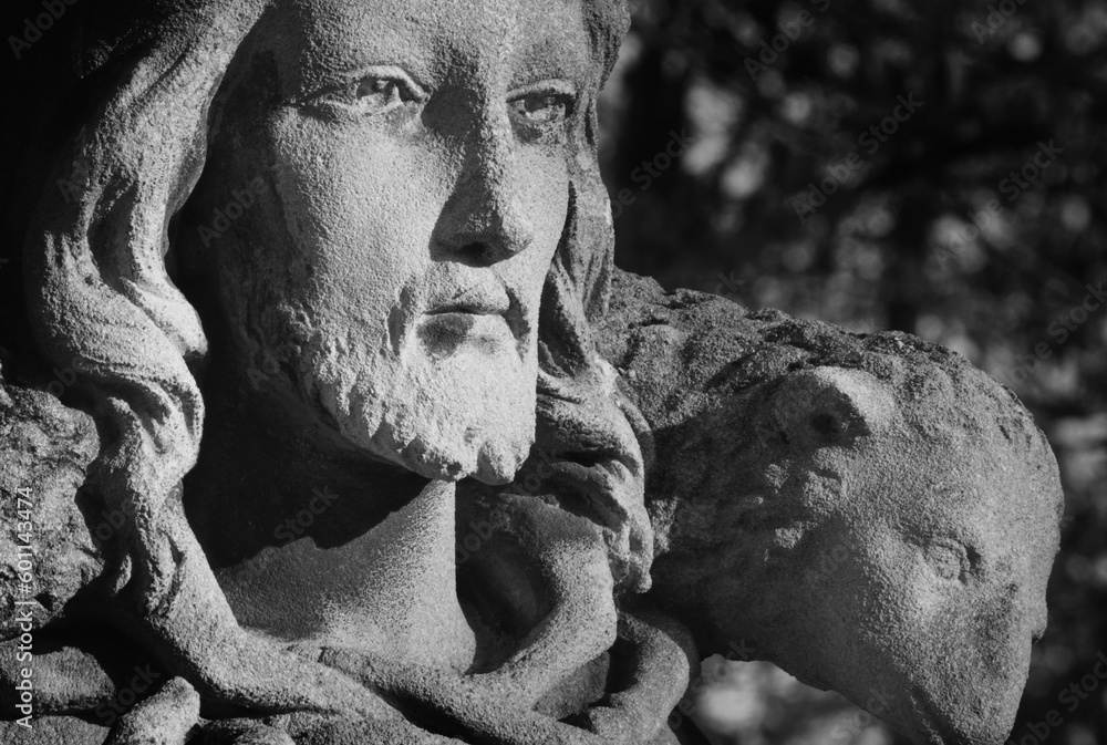 Jesus Christ - the Good Shepherd. Horizontal image of an ancient statue ...