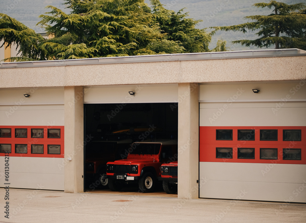 Fire station in Italy. Fire department with opened garage and retro ...