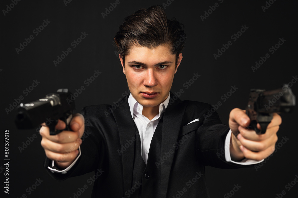 Young mafia member with a slicked back hair, in black suit, cigar ...