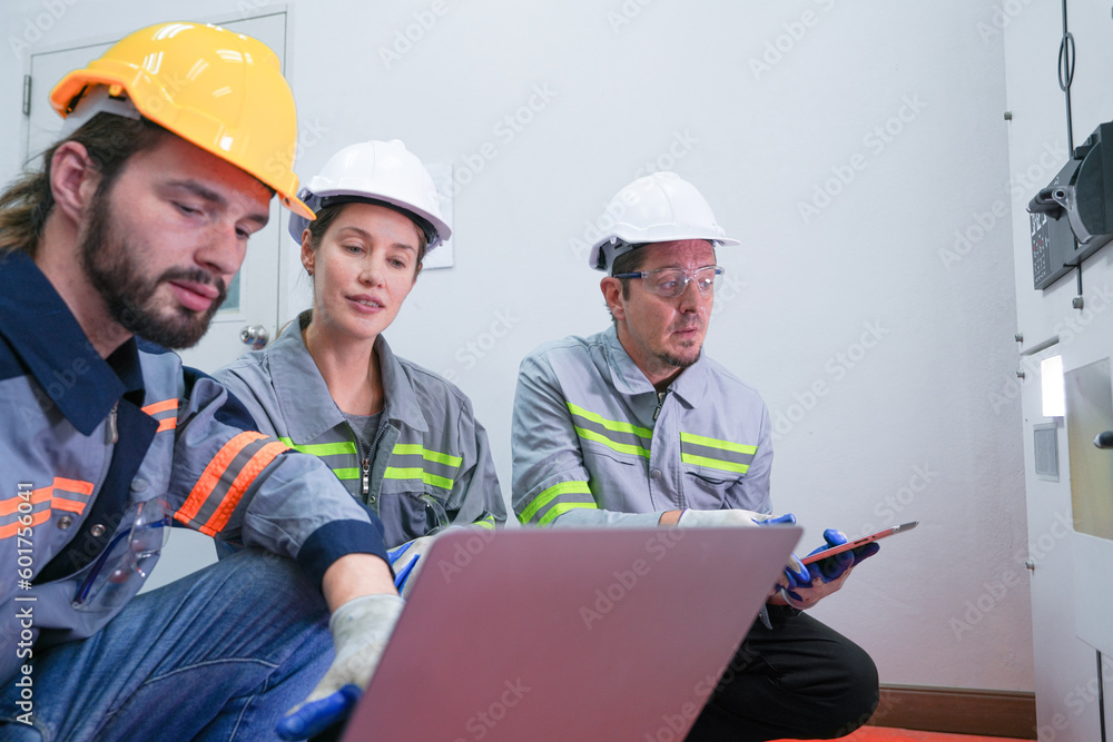 Professional engineer workers training and testing machine at industry ...