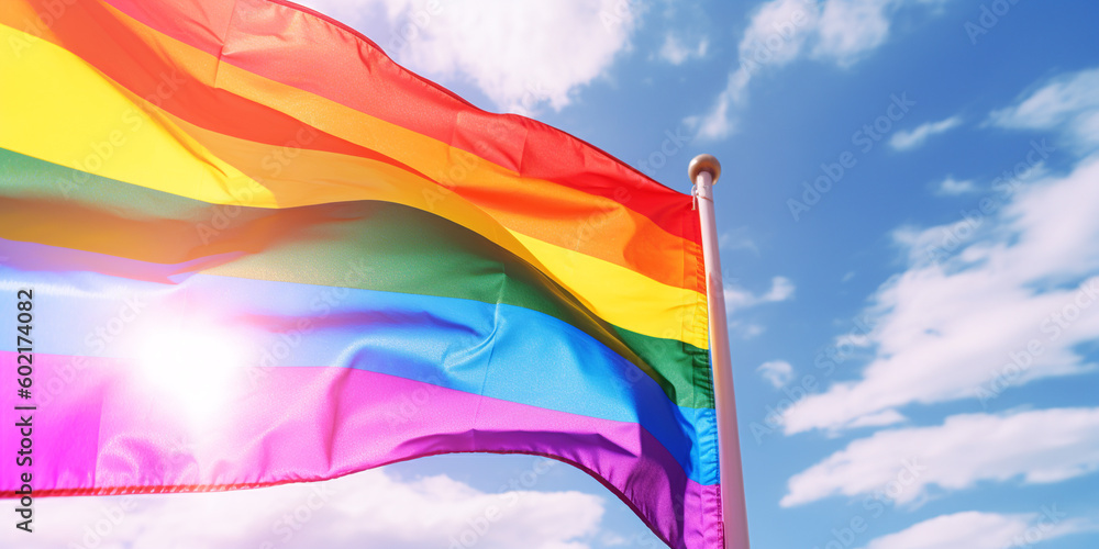 LGTB flag waving on blue sky, LGTBQ community rainbow progress flag ...