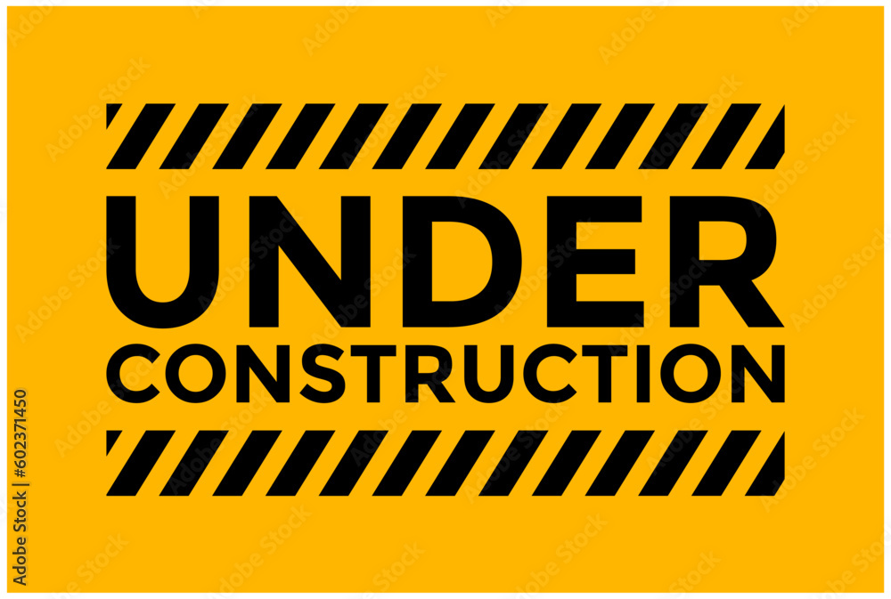 Under construction warning sign text with yellow black stripes painted ...