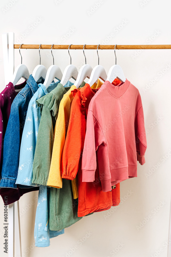 Clothing Rack with children's outfits close up. Fashion clothes in ...