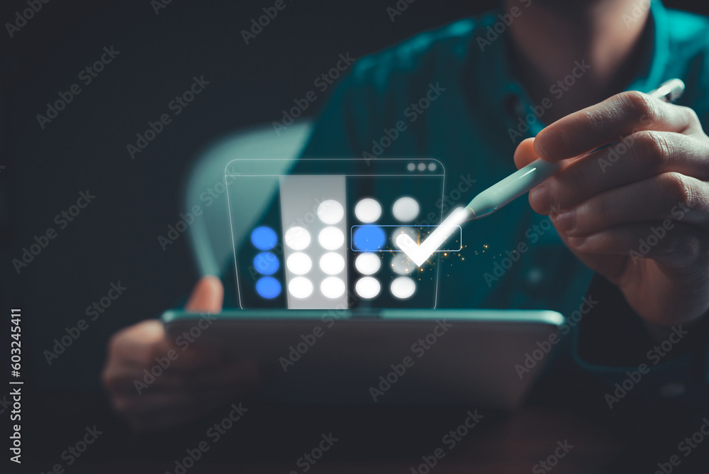 person typing on a touch screen schedule plan calendar. project gantt ...
