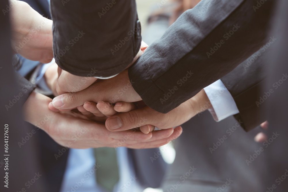 Stock-Foto „business people putting join hands together. Unity and teamwork show by Stack mix of ...