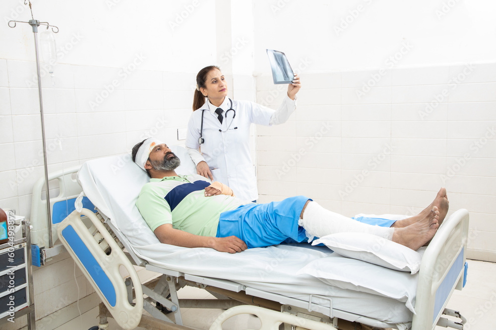 Indian man patient lying on bed with fractured leg and orthopedic ...