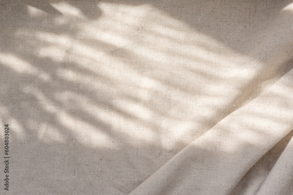 Beige linen fabric texture with folds and natural floral sunlight ...