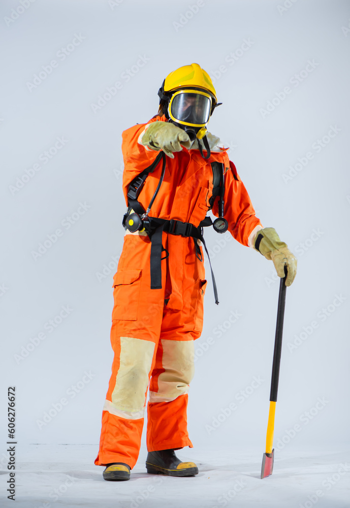 In a commanding and purposeful stance the professional firefighter ...