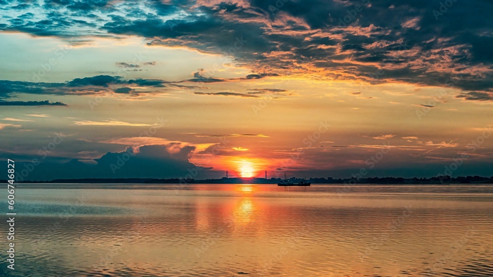 Faro island with dramatic sunset sky with gloomy clouds visible from ...