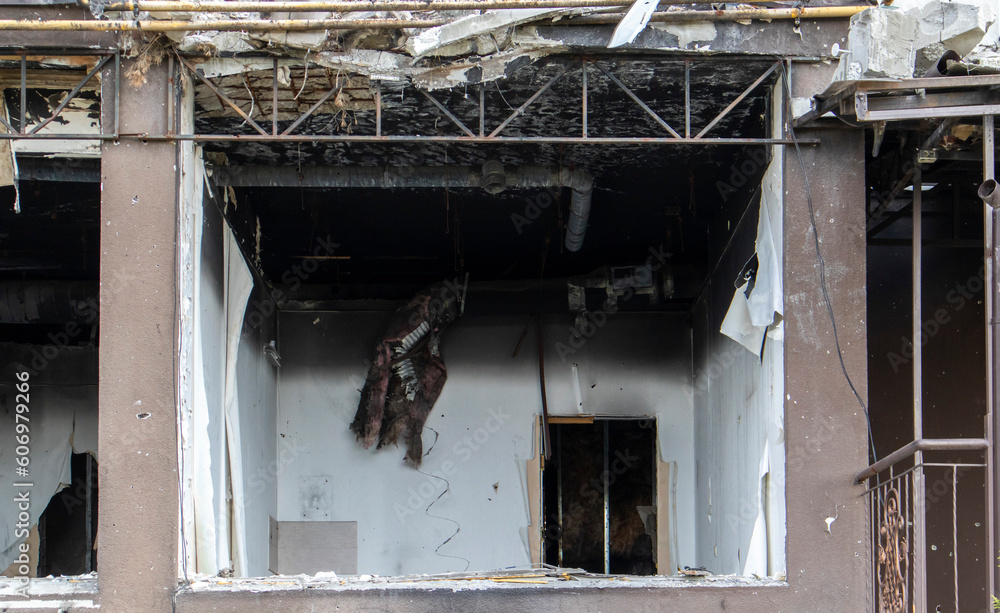 Residential buildings, windows and balconies were damaged by the blast ...