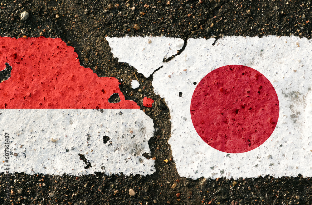 On the pavement are images of the flags of Indonesia and Japan, as a ...