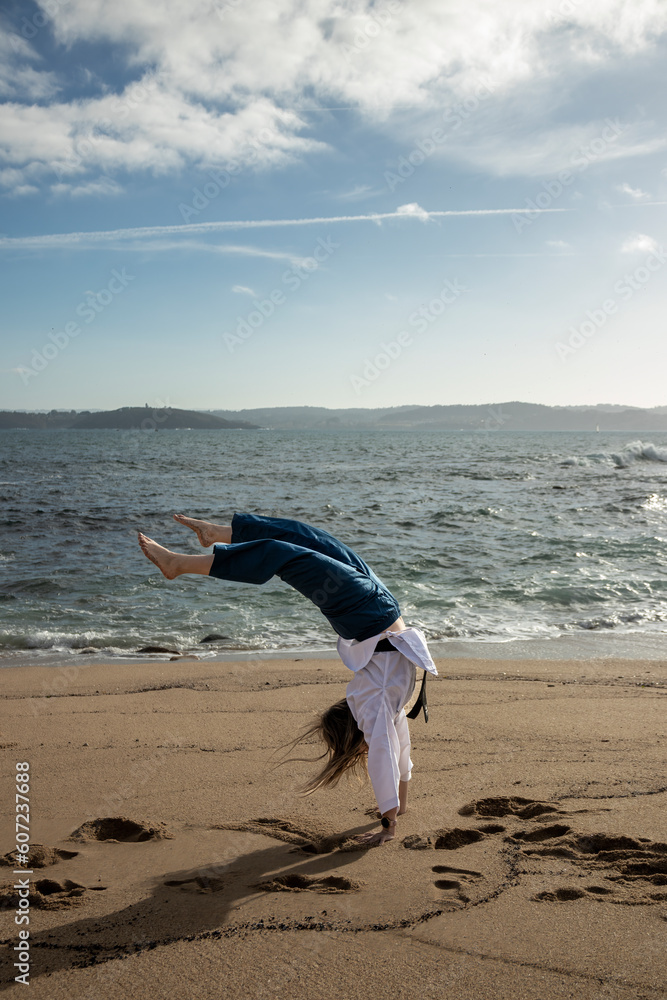 Energetic Martial Arts Training on the Beach: A Young Woman ...