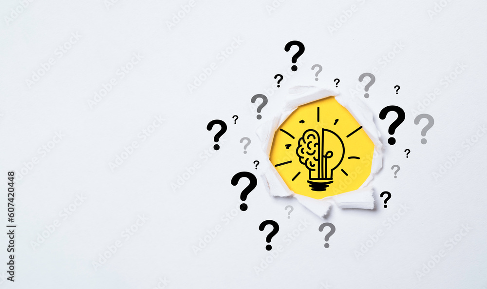 Lightbulb drawing inside of punch paper with questions mark for ...